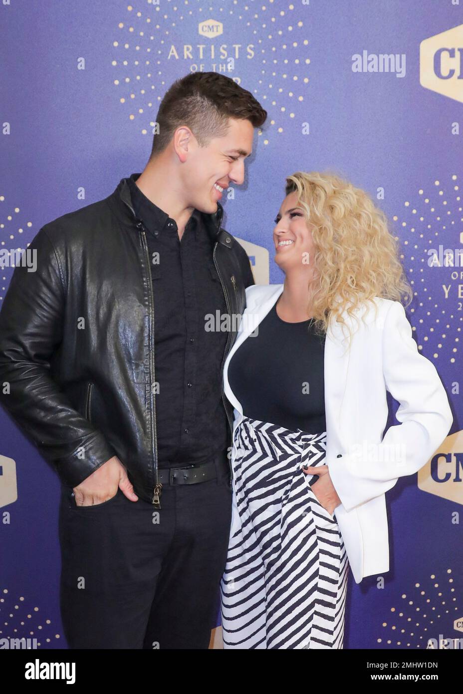 Tori Kelly, right, with her husband, Andre Murillo arrive at 2019 CMT ...