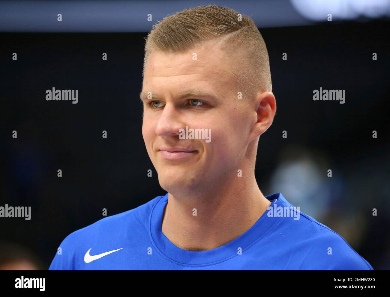 Dallas Mavericks forward Kristaps Porzingis (6) smiles as he walks off ...