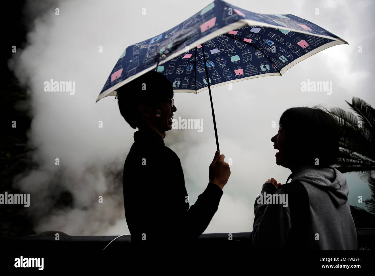 Visitors laugh as they visit the hot springs in Beppu, Japan, Thursday ...