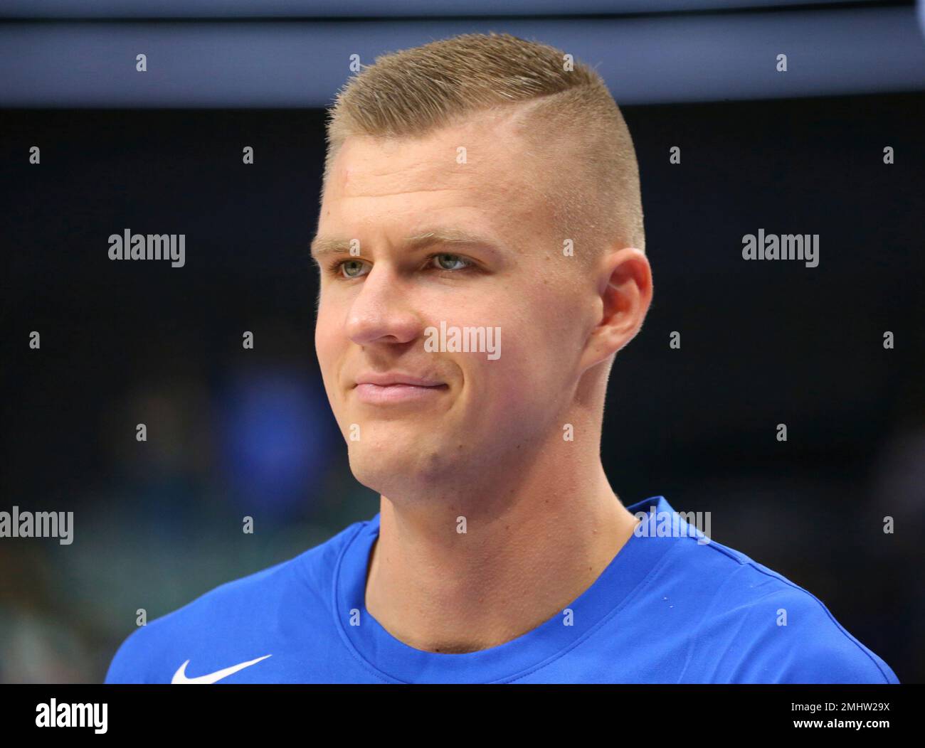 Dallas Mavericks forward Kristaps Porzingis (6) smiles as he walks off ...