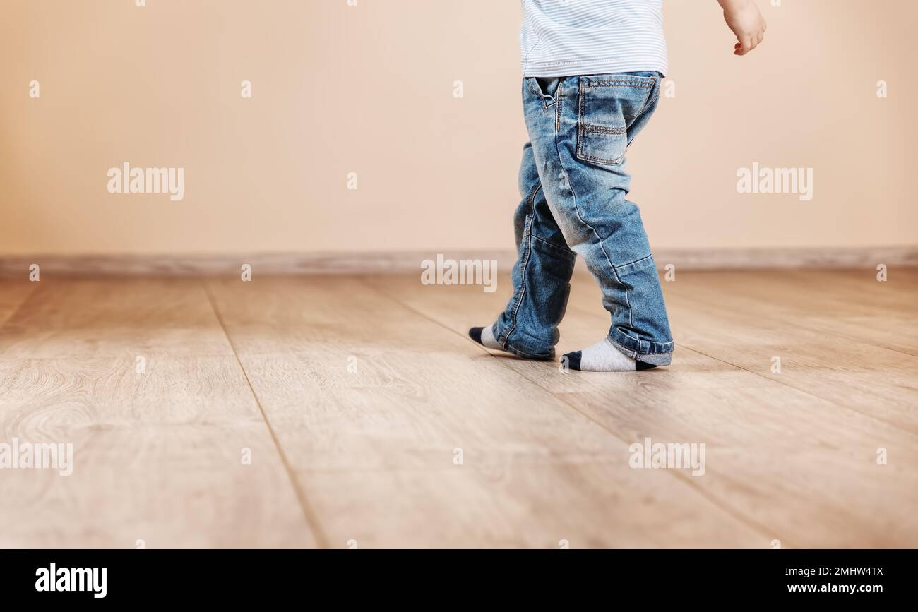 Child walking along of the living room Stock Photo - Alamy