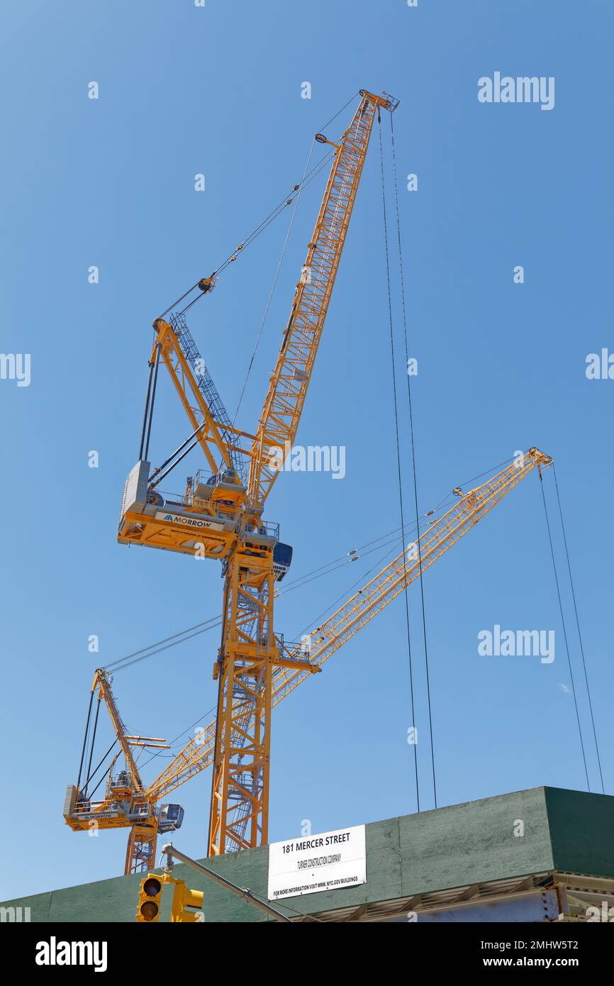 Morrow Equipment Company luffing boom cranes tower over site of 181 ...