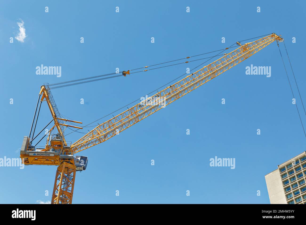 Morrow Equipment Company luffing boom crane towers over site of 181 ...