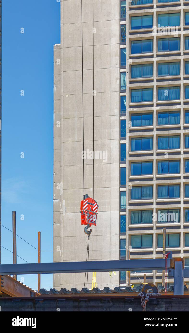 Liebherr load block and load line, against backdrop of NYU’s Washington ...