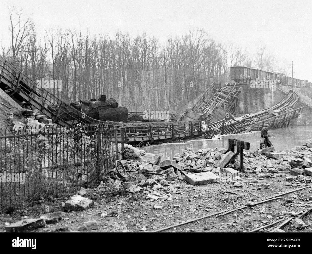 Twisted steel girders and broken ties are all that remain of this ...