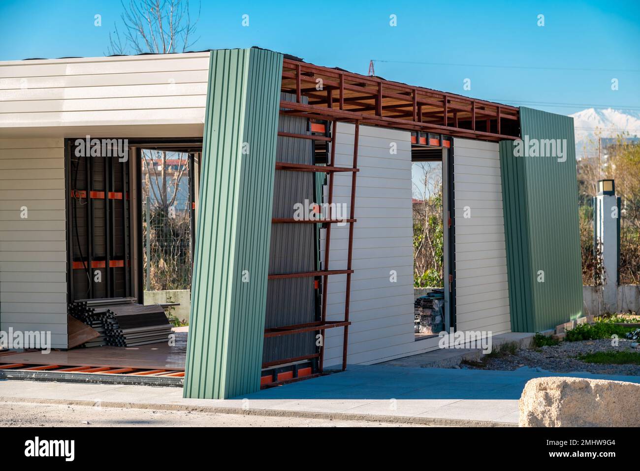 Newly built metal framed building with siding. Construction of a new ...