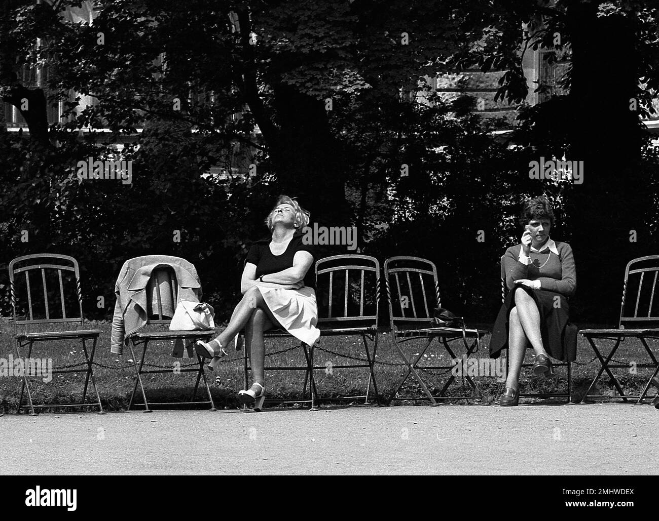 Women taking sun at a public park, Vienna, Austria, 1978 Stock Photo - Alamy