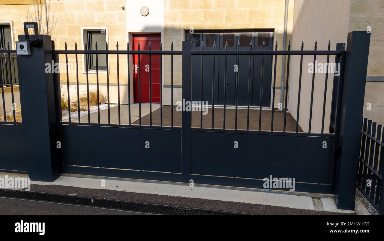 dark modern grey gate aluminum portal with blades of suburb house Stock ...