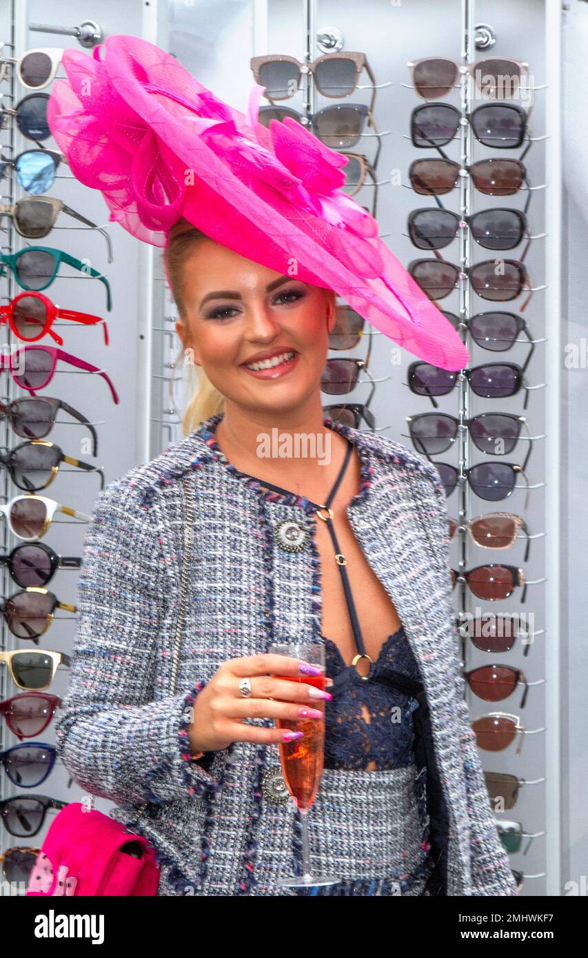Women's high-end fashion, decorative fancy frocks and hats. Racegoers ...