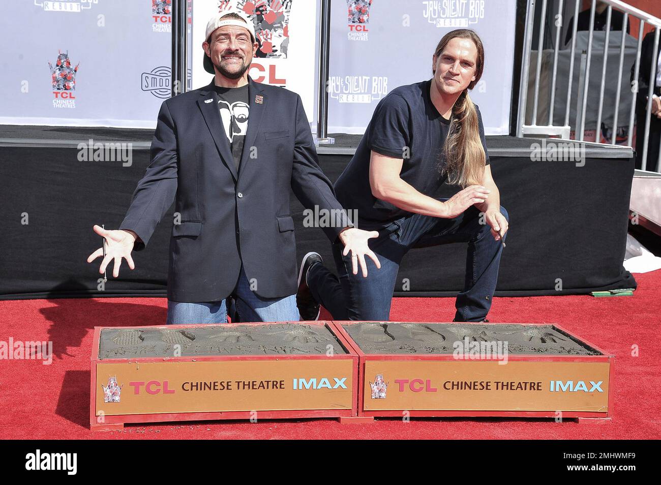 Kevin Smith, left, and Jason Mewes appear at their hand and footprint ...