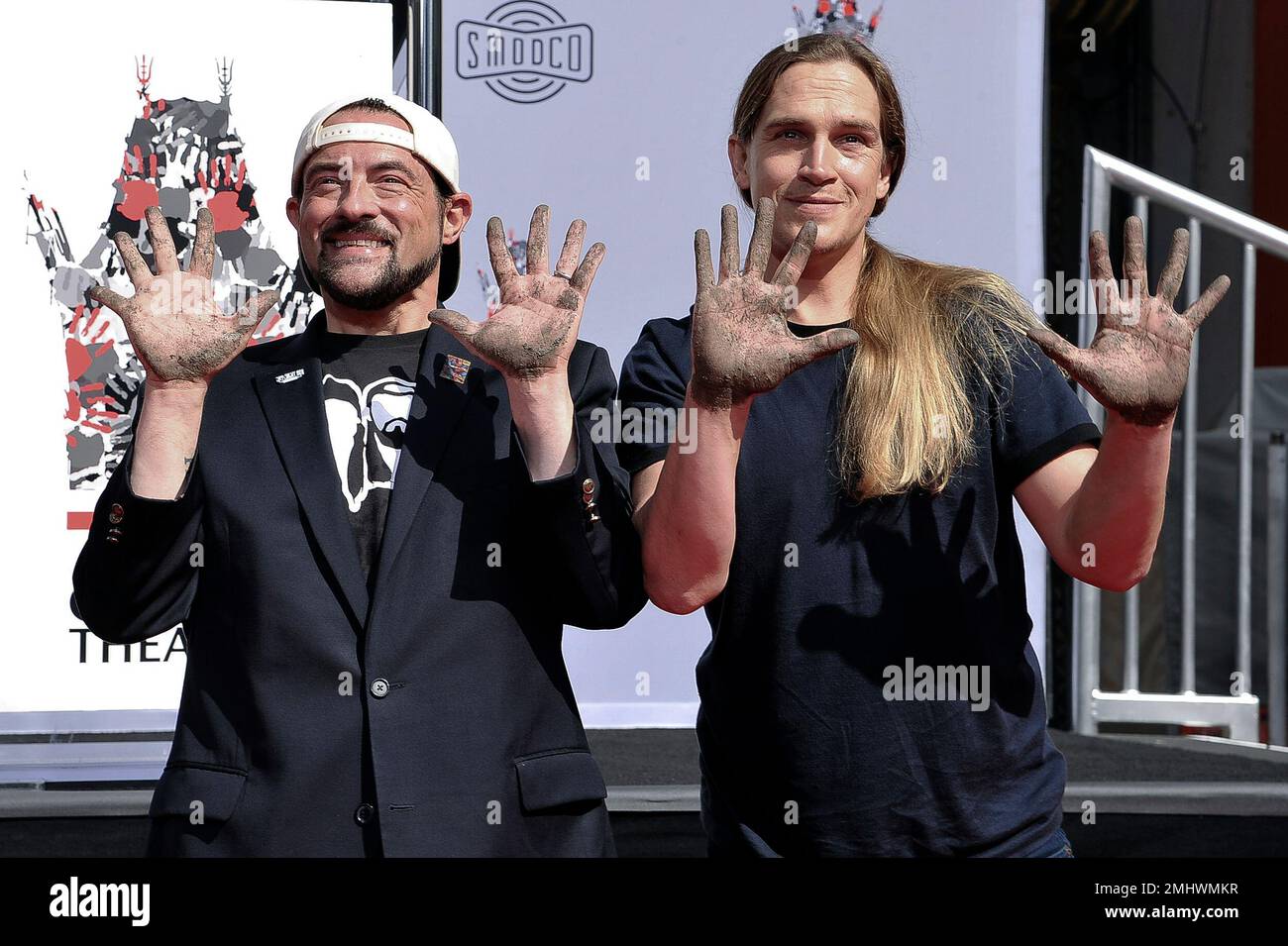 Kevin Smith, left, and Jason Mewes appear at their hand and footprint ...