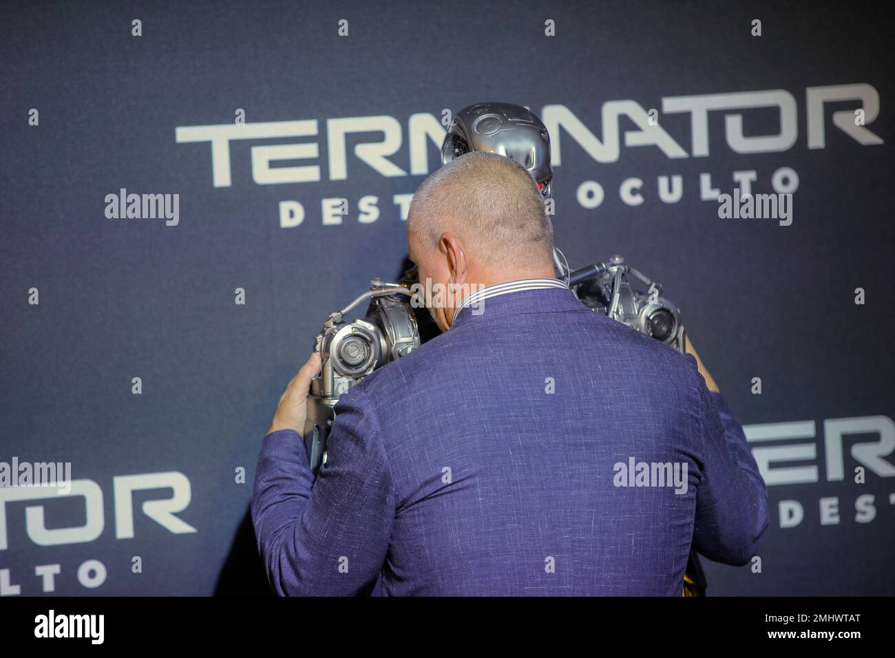 U.S. director Tim Miller hugs a terminator statue during the red carpet ...