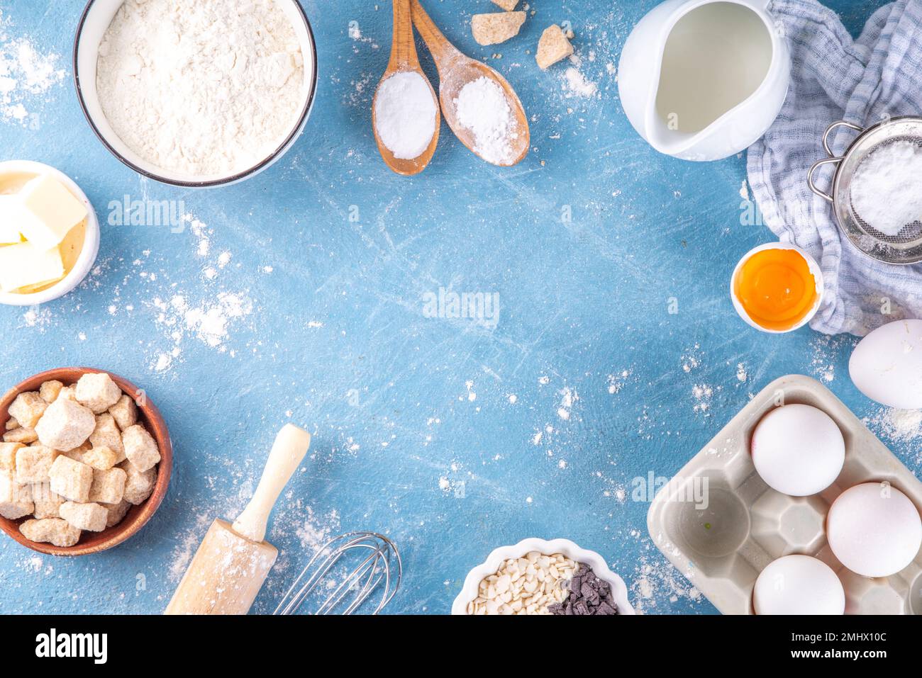 Baking ingredients background. Cooking ingredients (flour, eggs, milk ...