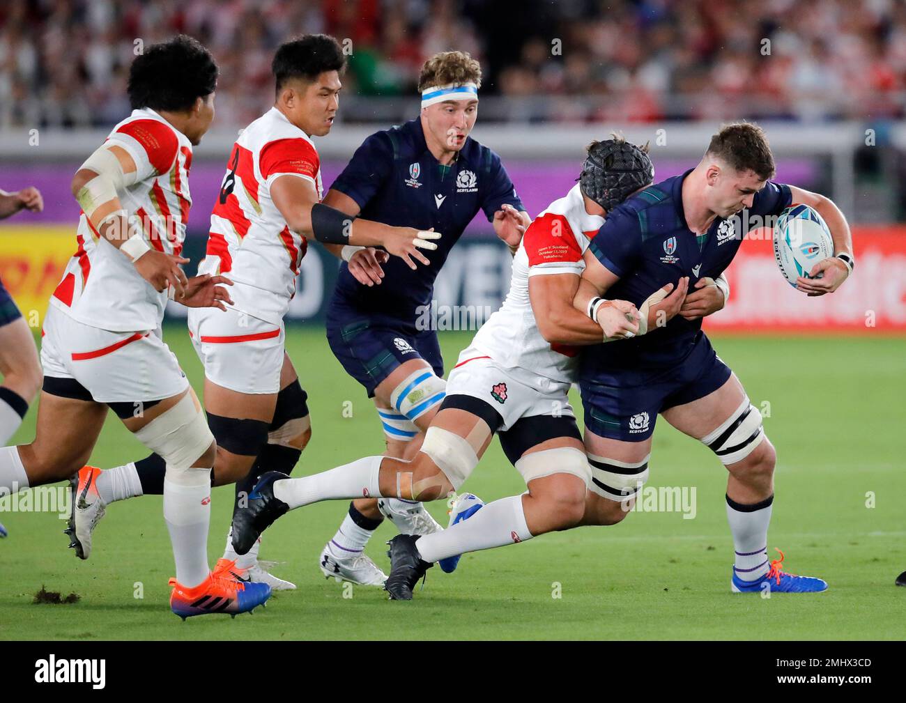 Scotland's Magnus Bradbury is tackled by Japan defenders during the ...