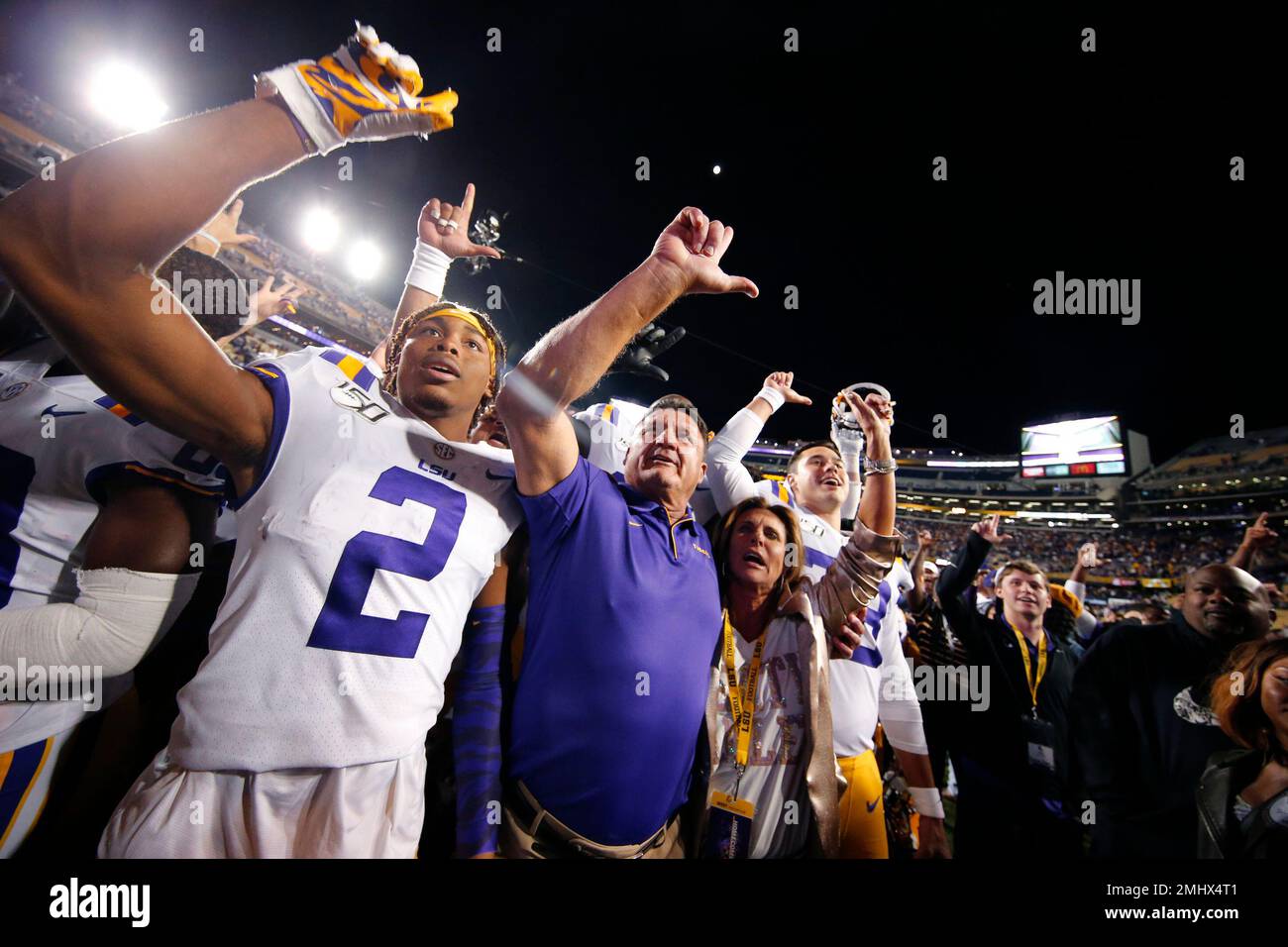LSU coach Ed Orgeron sings the alma mater with wide receiver Justin Jefferson (2); Orgeron's ...