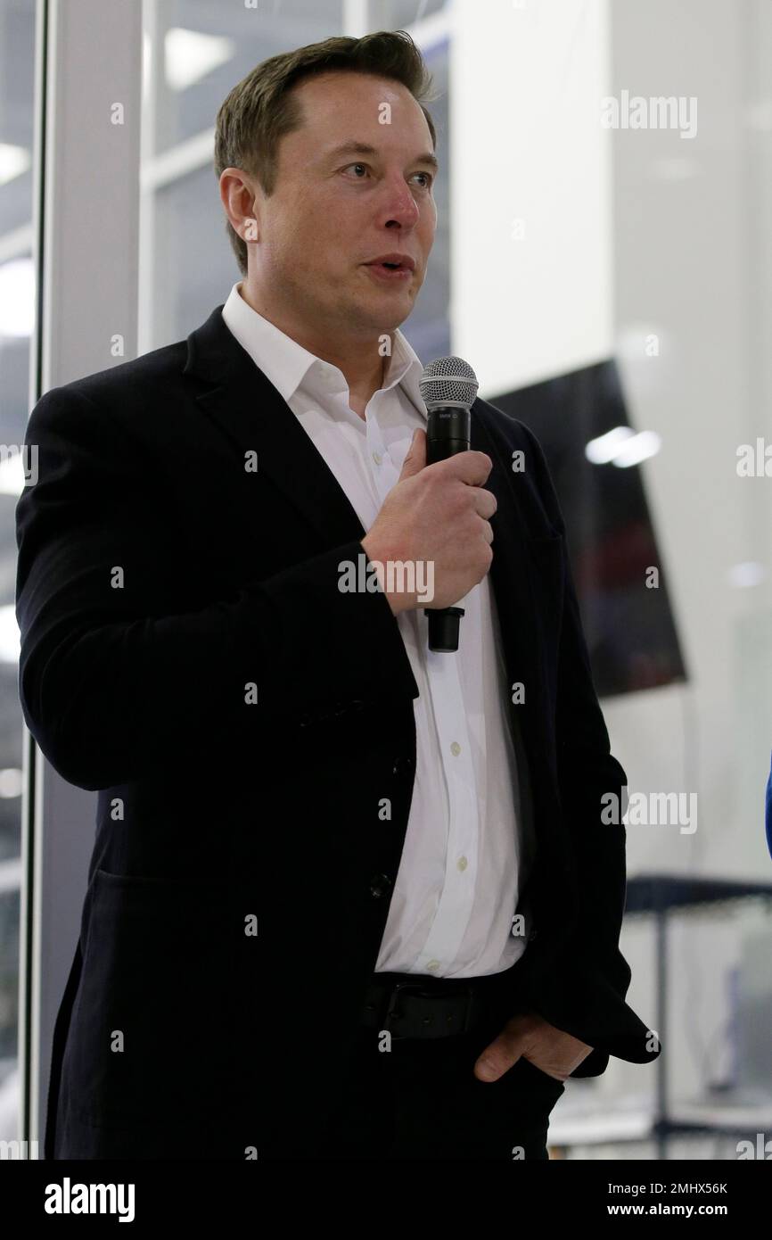 SpaceX chief engineer Elon Musk talks to the media in front of the Crew ...