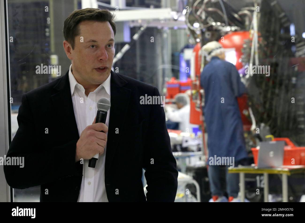 SpaceX chief engineer Elon Musk talks to the media in front of the Crew ...
