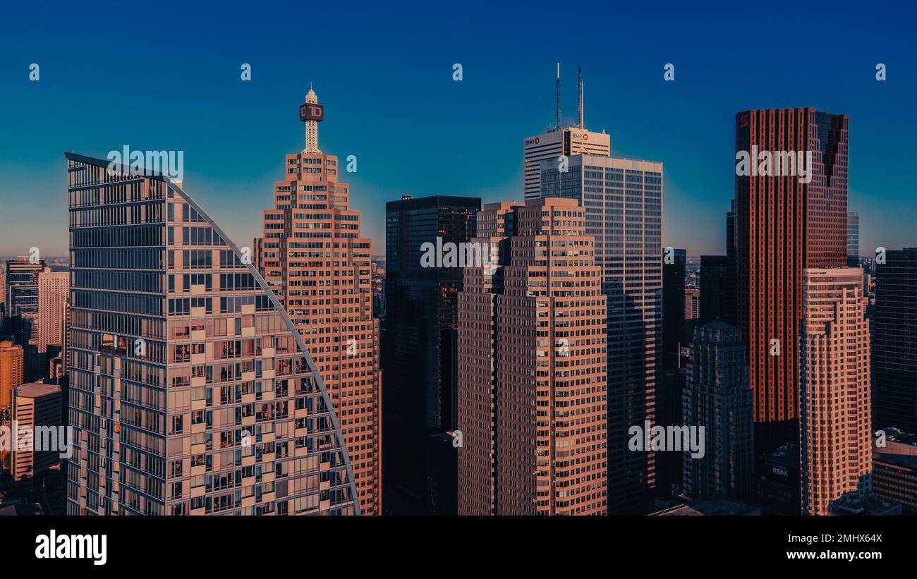 An aerial view of the city buildings in Toronto, Canada during sunrise ...