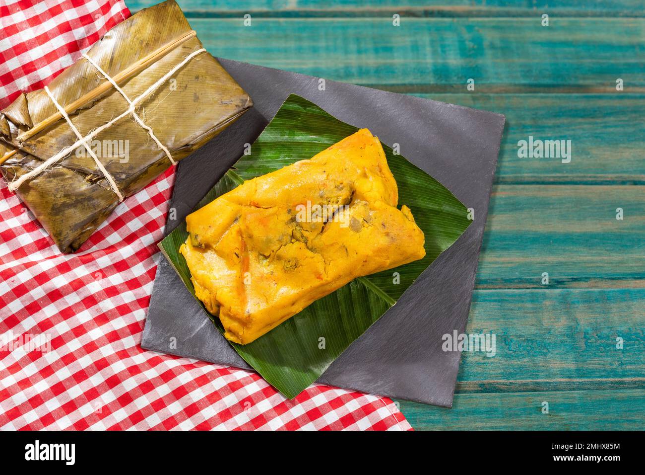 Tamale Typical Colombian Food Wrapped In Banana Leaves Stock Photo - Alamy