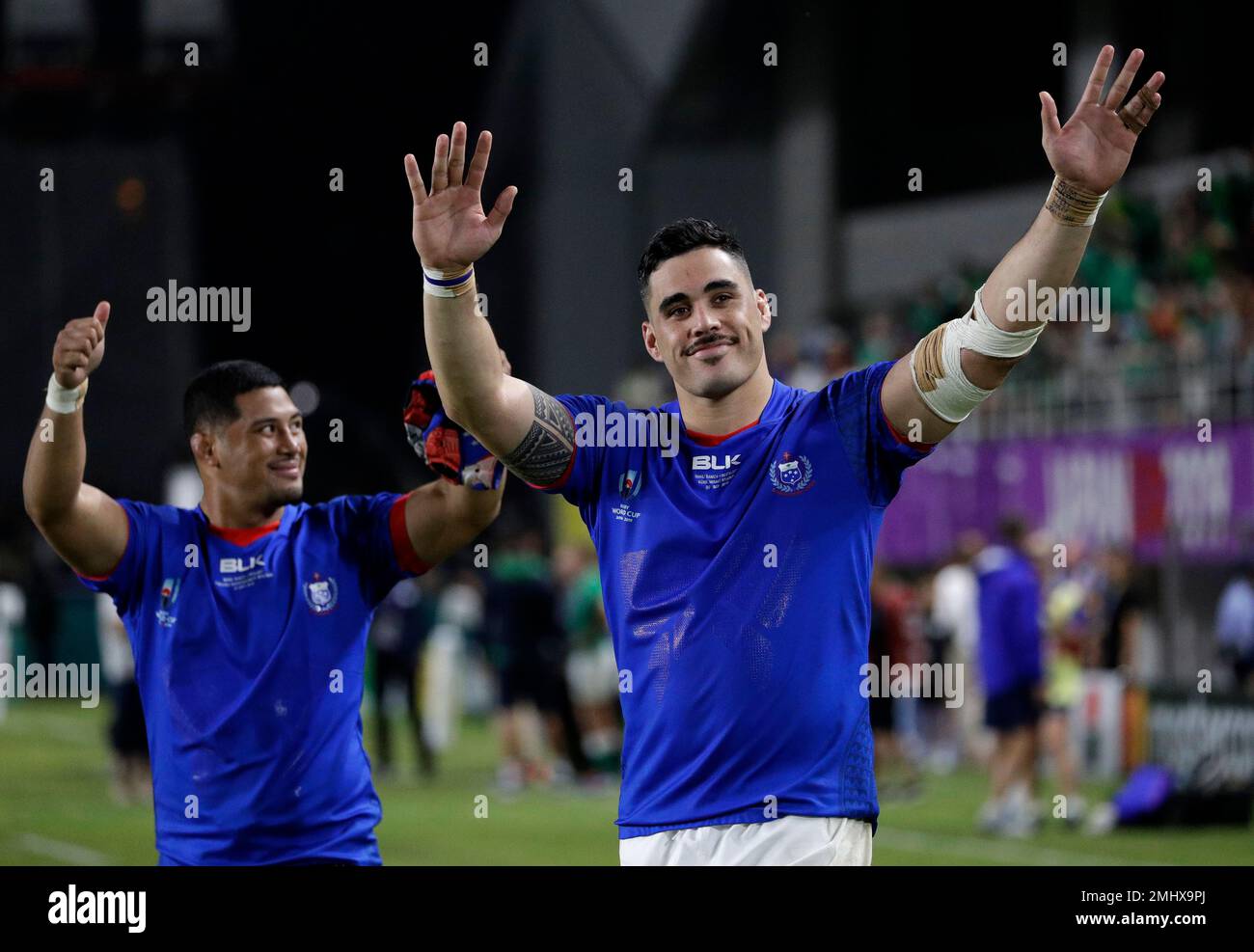 Samoa's Kane Le'aupepe, right, and teammate Seilala Lam wave to the ...