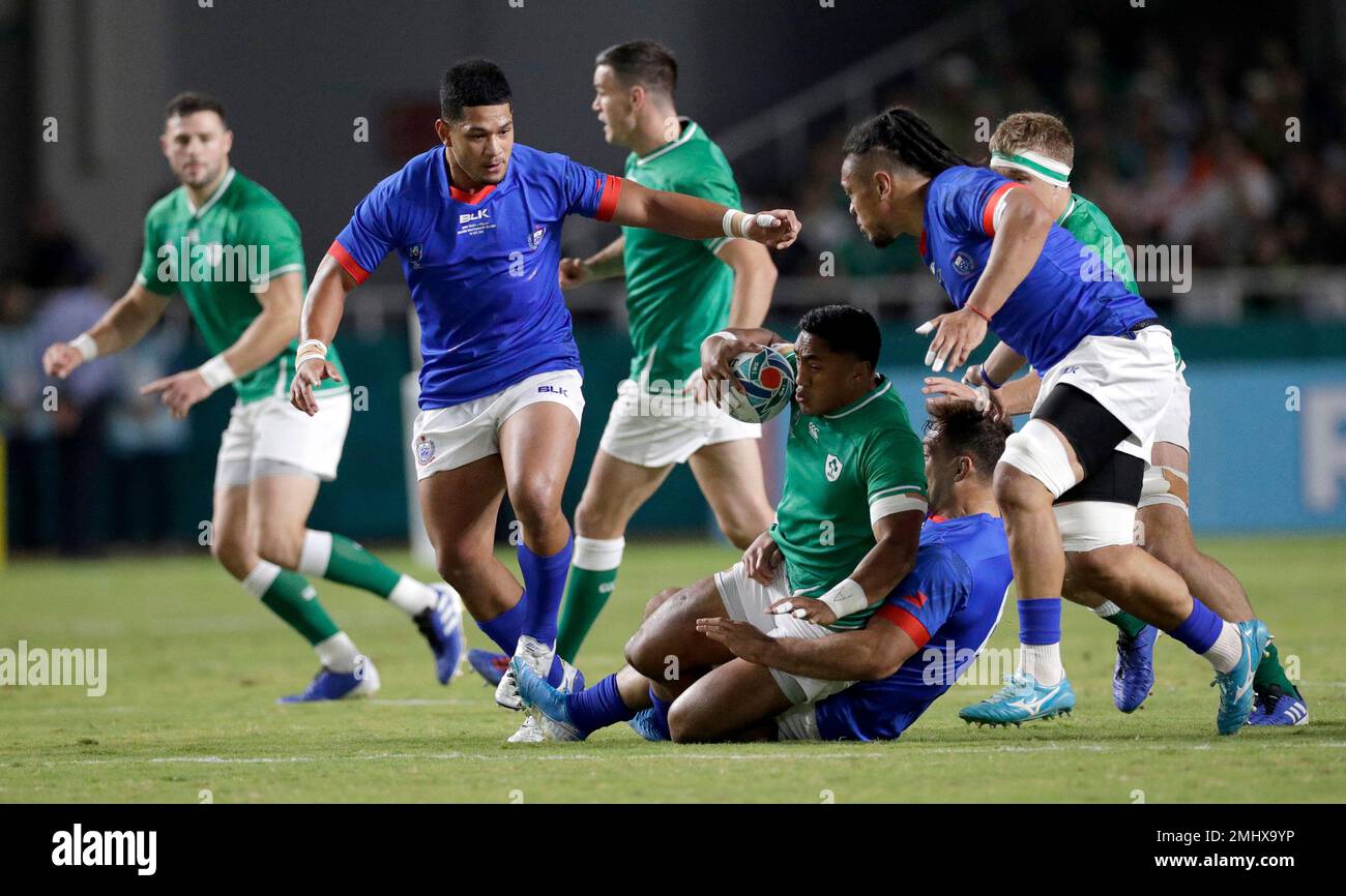 Ireland's Bundee Aki is tackled by the Samoan defence during the Rugby ...