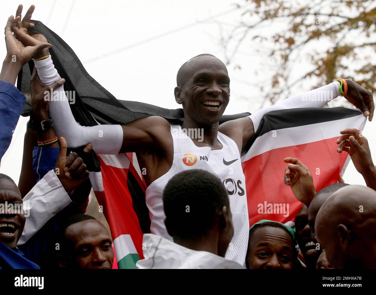 Marathon runner Eliud Kipchoge from Kenya is celebrated after crossing ...