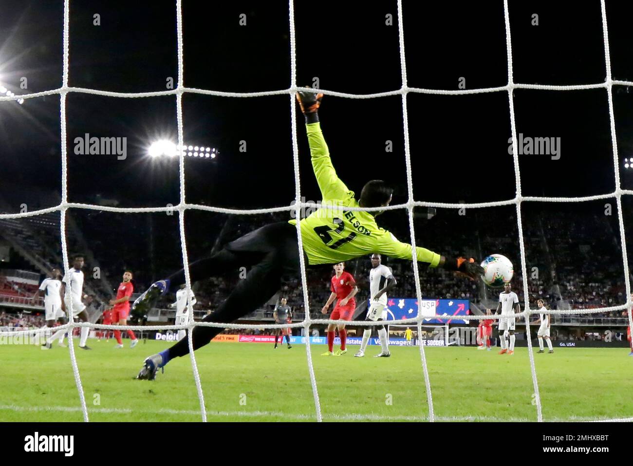 Cuba goalkeeper Nelson Johnston (21) deflects a shot by United States ...