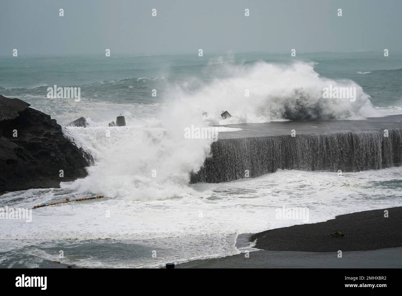 Surging waves hitting against the breakwater while Typhoon Hagibis ...