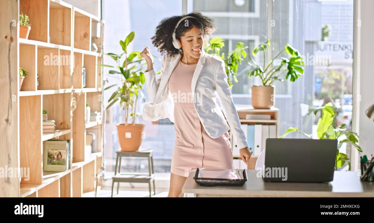 Business laptop, dance and black woman in office celebrating successful ...