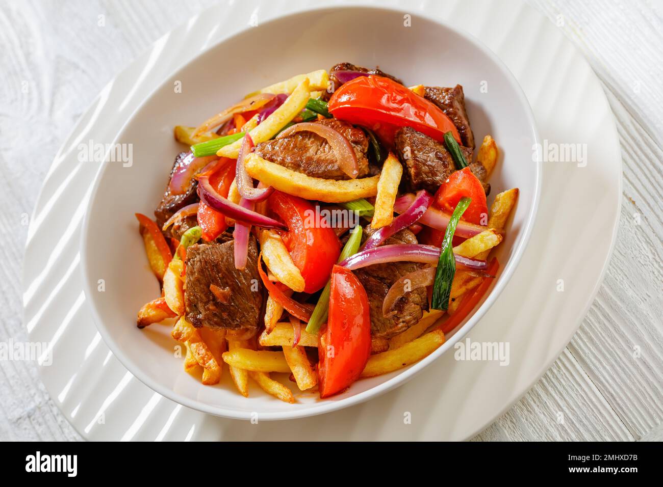 Lomo saltado, Peruvian dish of stir-fried slices of beef sirloin ...