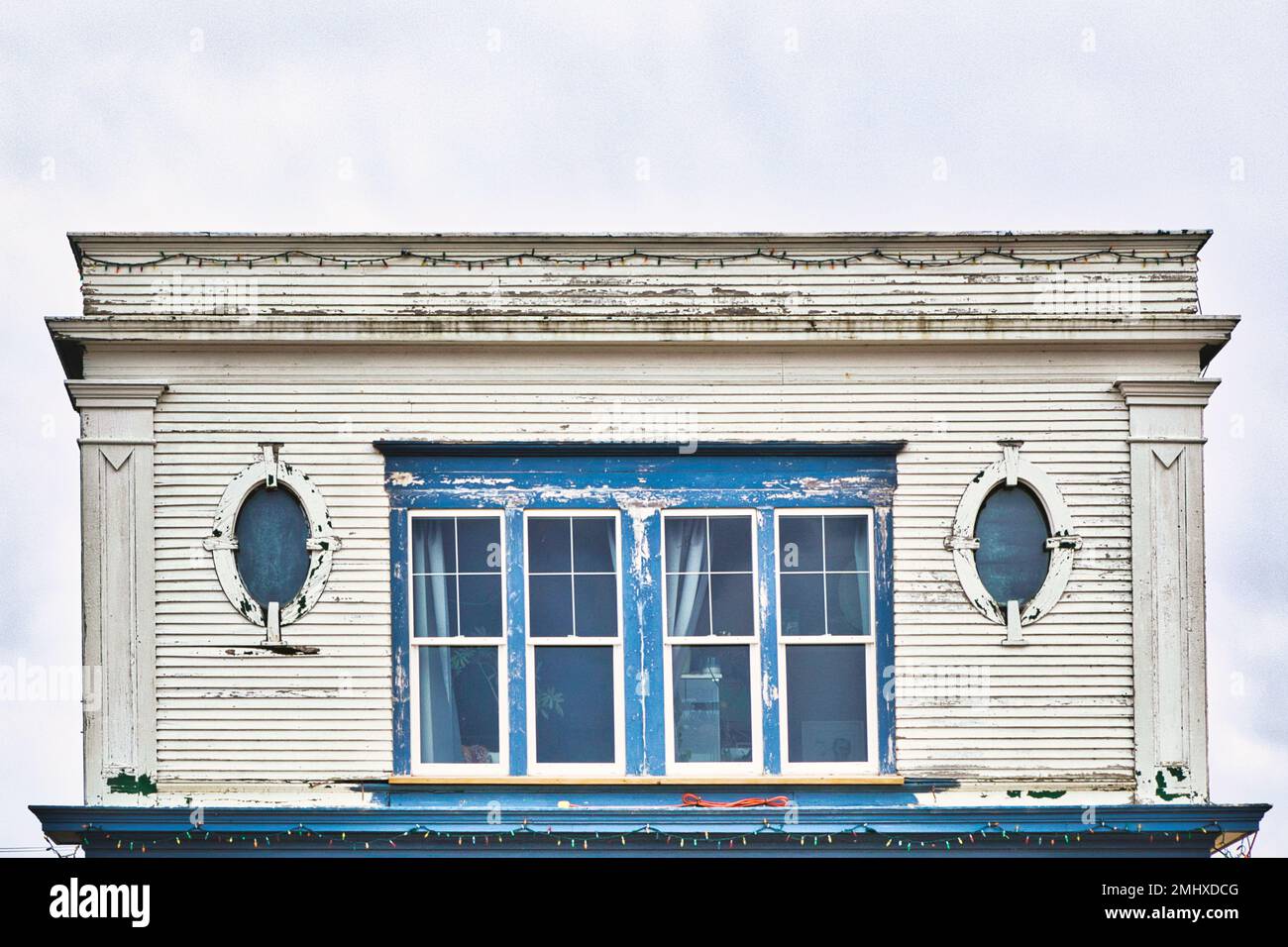 Close up of the second story of an old unused beautiful bank with big ...