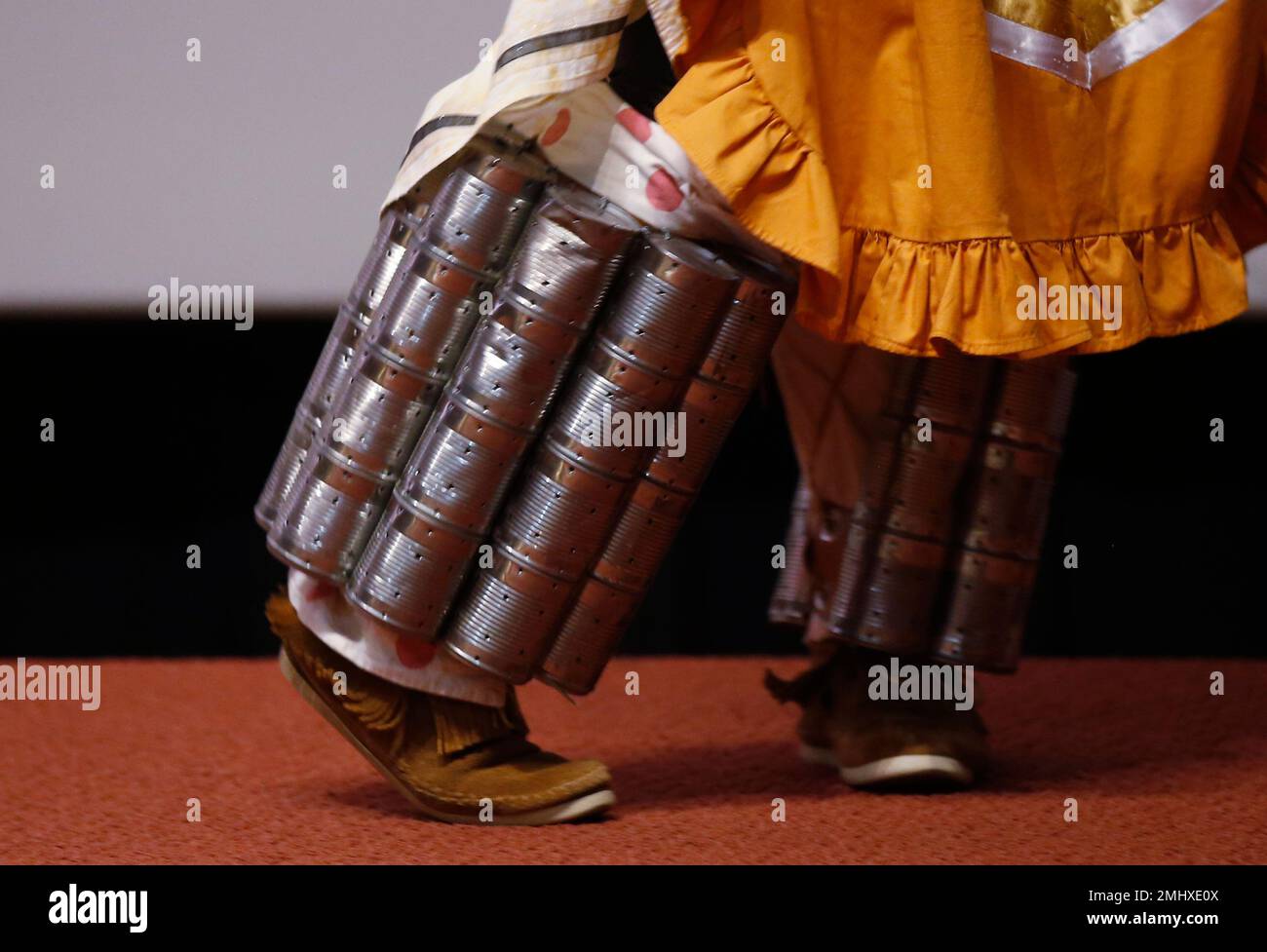 Modern-day Stomp Dance rattles, made from tin cans, are worn by a ...