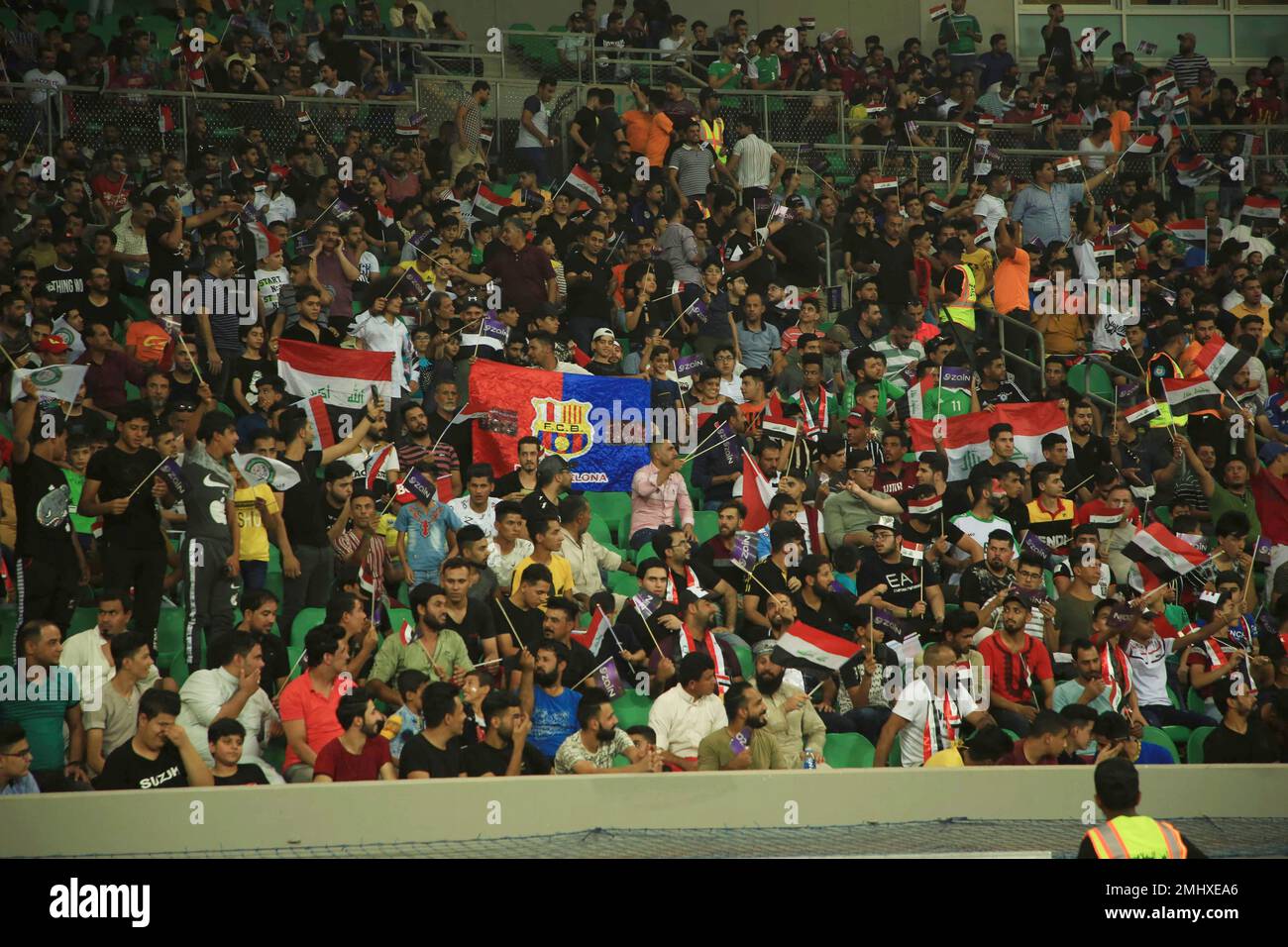 In this Thursday, Oct. 10, 2019 photo, Iraqi football fans hold up ...