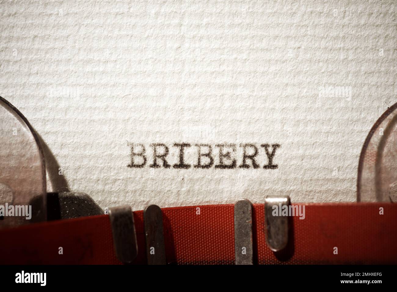 Bribery word written with a typewriter Stock Photo - Alamy