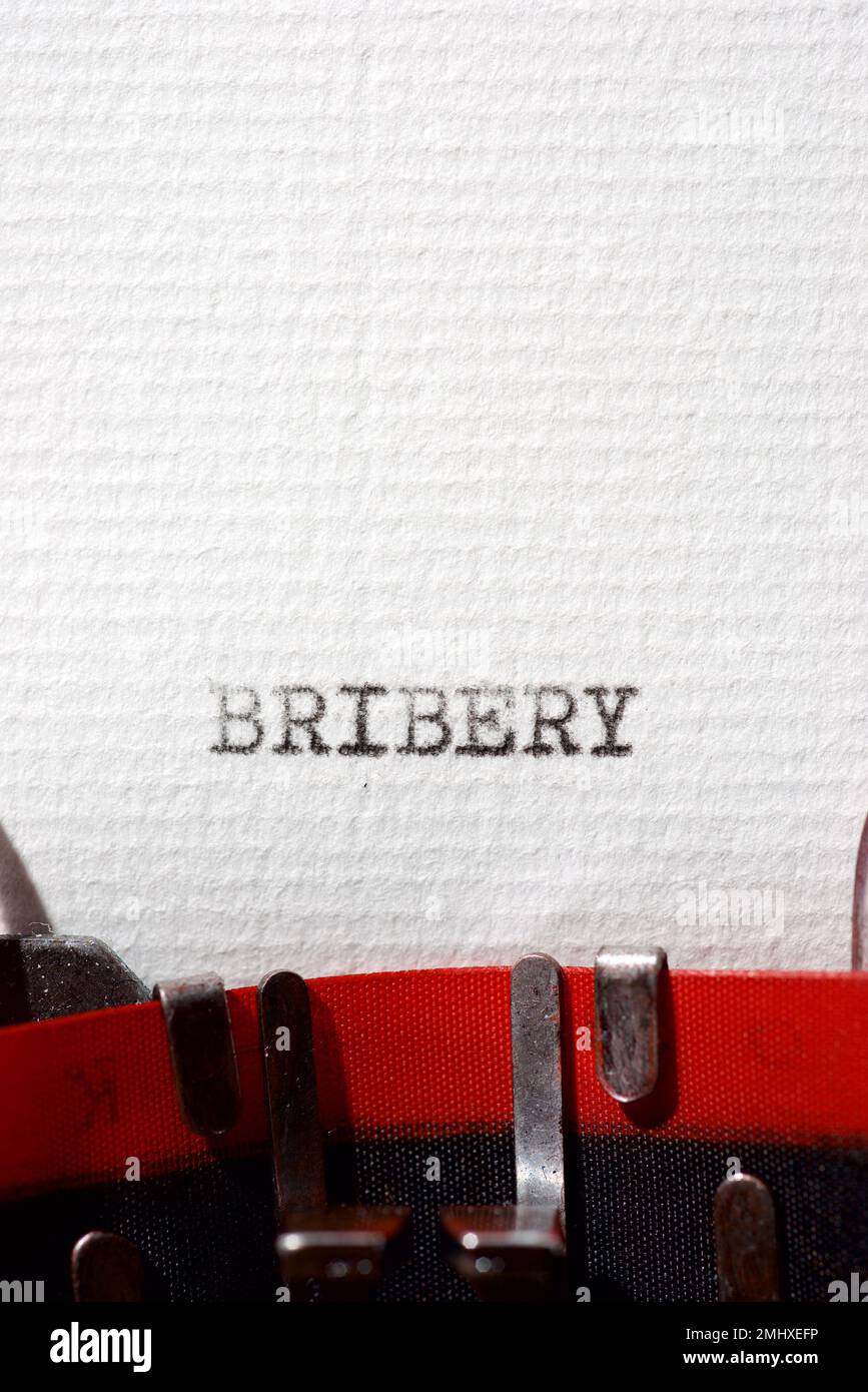 Bribery word written with a typewriter Stock Photo - Alamy