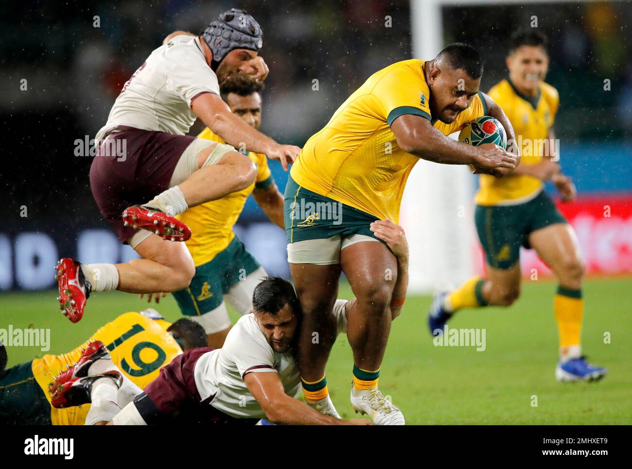 Australia's Taniela Tupou runs at the Georgian defence during the Rugby ...