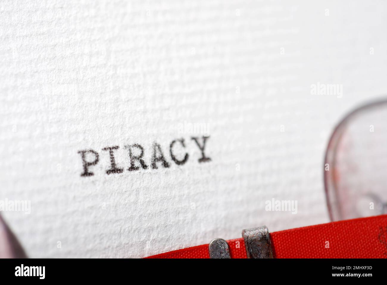 Piracy word written with a typewriter Stock Photo - Alamy