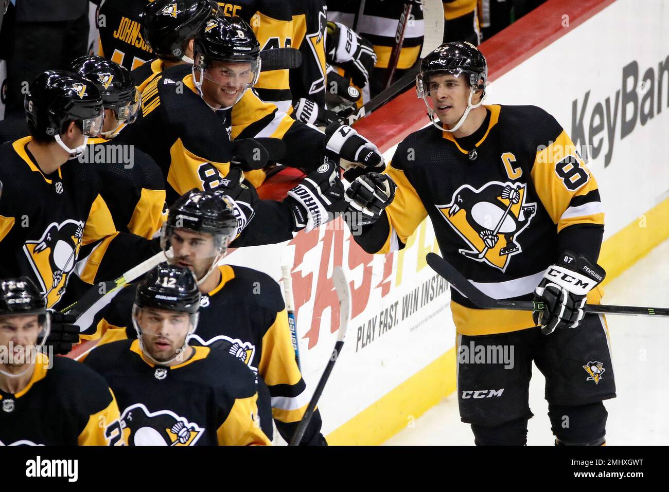 Pittsburgh Penguins' Sidney Crosby (87) returns to the bench after ...