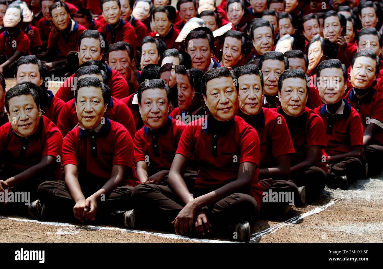 In this Oct. 10, 2019, photo, Indian school children wear face masks of ...