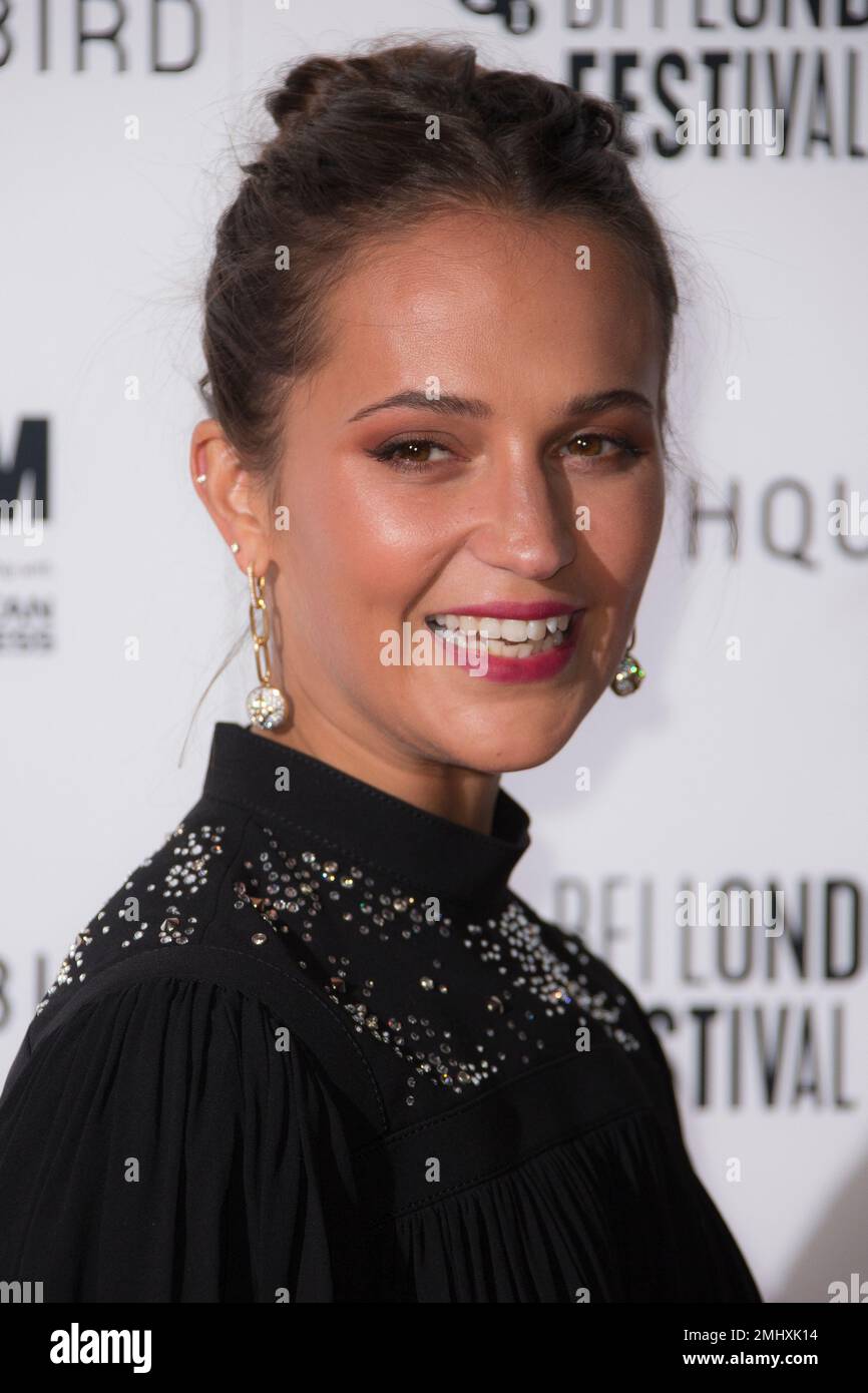 Actress Alicia Vikander poses for photographers upon arrival at the ...