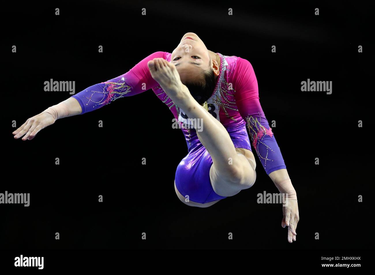 Tang Xijing of China performs on the balance beam in the women's all ...