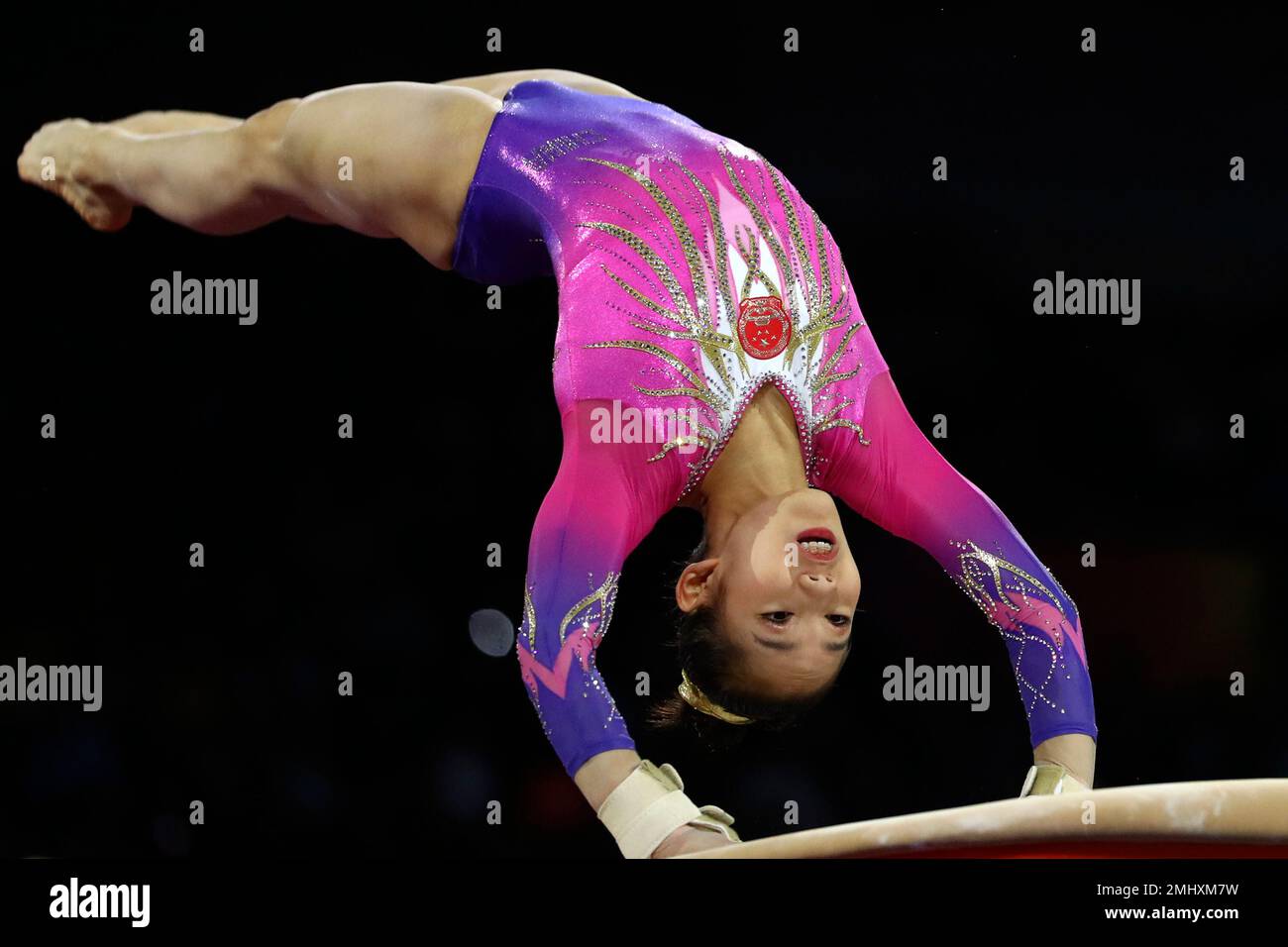 Tang Xijing of China performs on the vault in the women's all-around ...