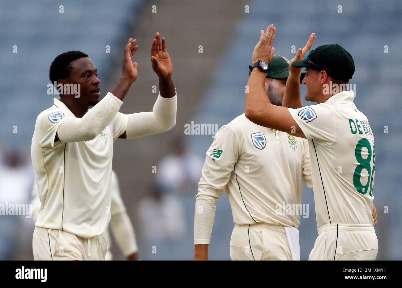 South Africa's Kagiso Rabada, left, celebrates with teammates the ...