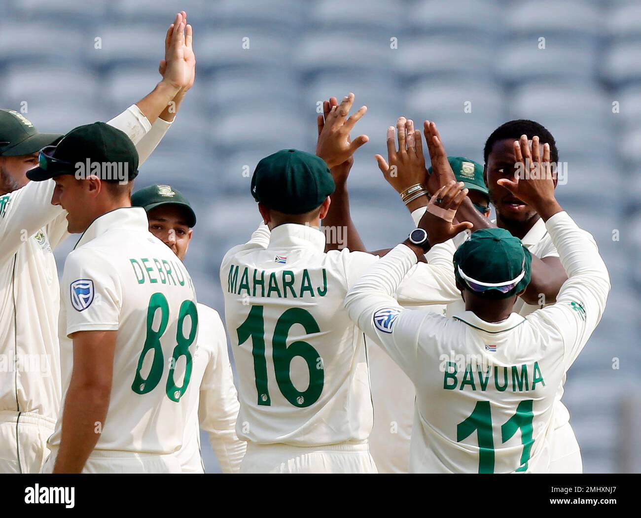 South Africa's Kagiso Rabada, right, celebrates with teammates the ...
