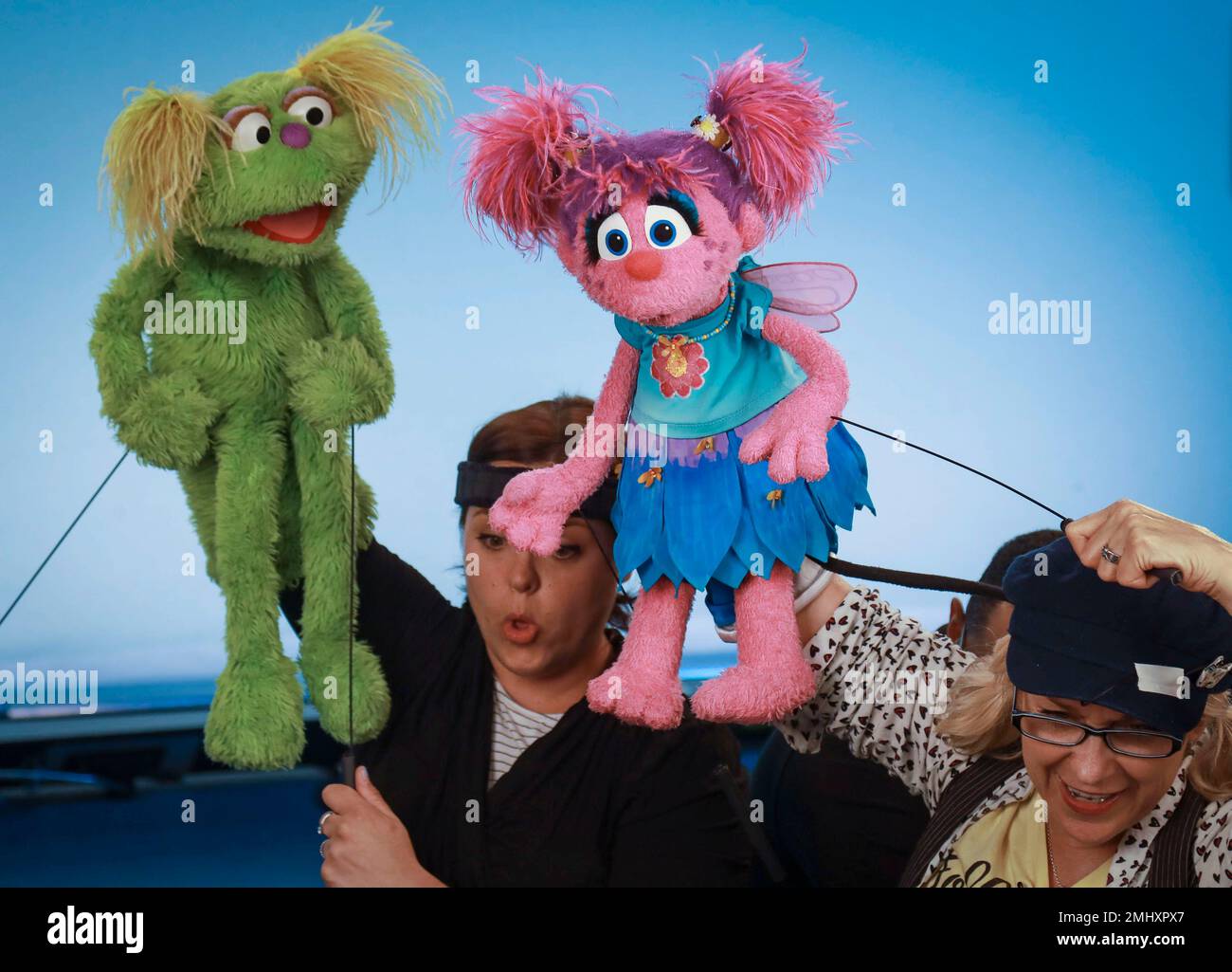 This Aug. 6, 2019 photo shows puppeteers Haley Jenkins, left, and ...