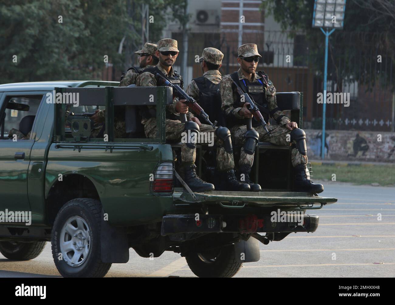 Pakistani security personnel guard the Gaddafi Stadium in Lahore ...
