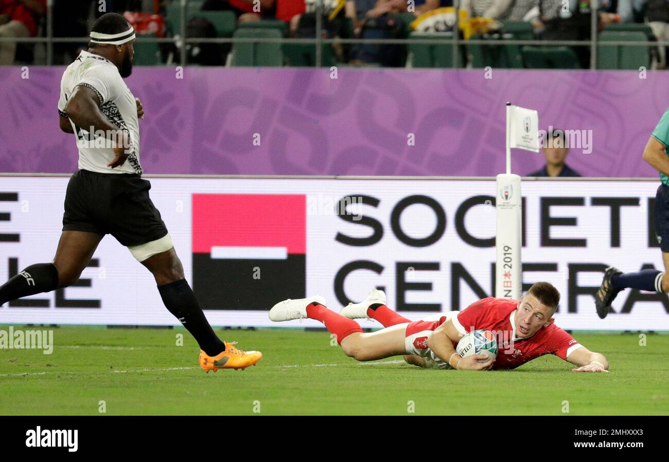 Wales' Josh Adams scores a try during the Rugby World Cup Pool D game ...