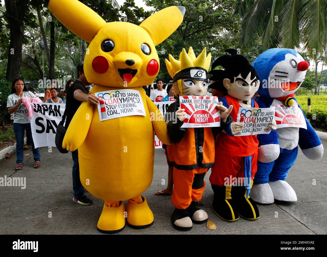 Environmental activists, dressed in anime costumes as, from left ...