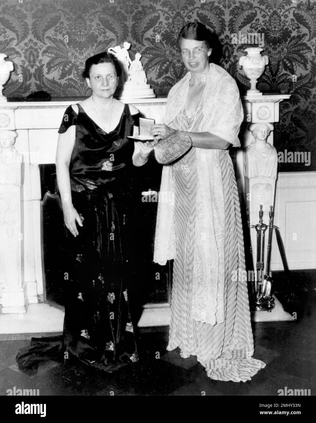 Frances Perkins, secretary of labor, left, receives the Chi Omega ...