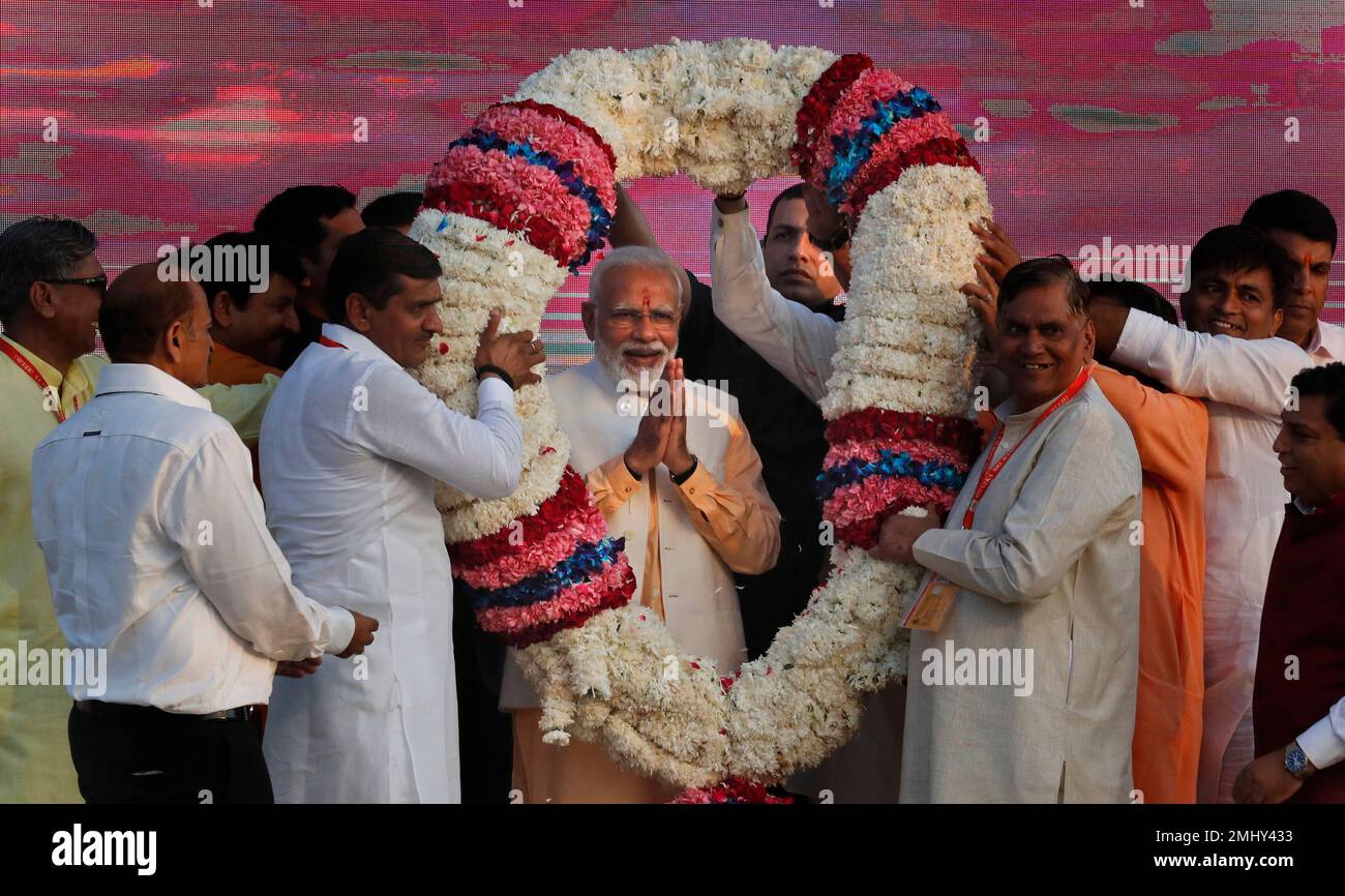 Indian Prime Minister Narendra Modi is presented with a huge floral ...